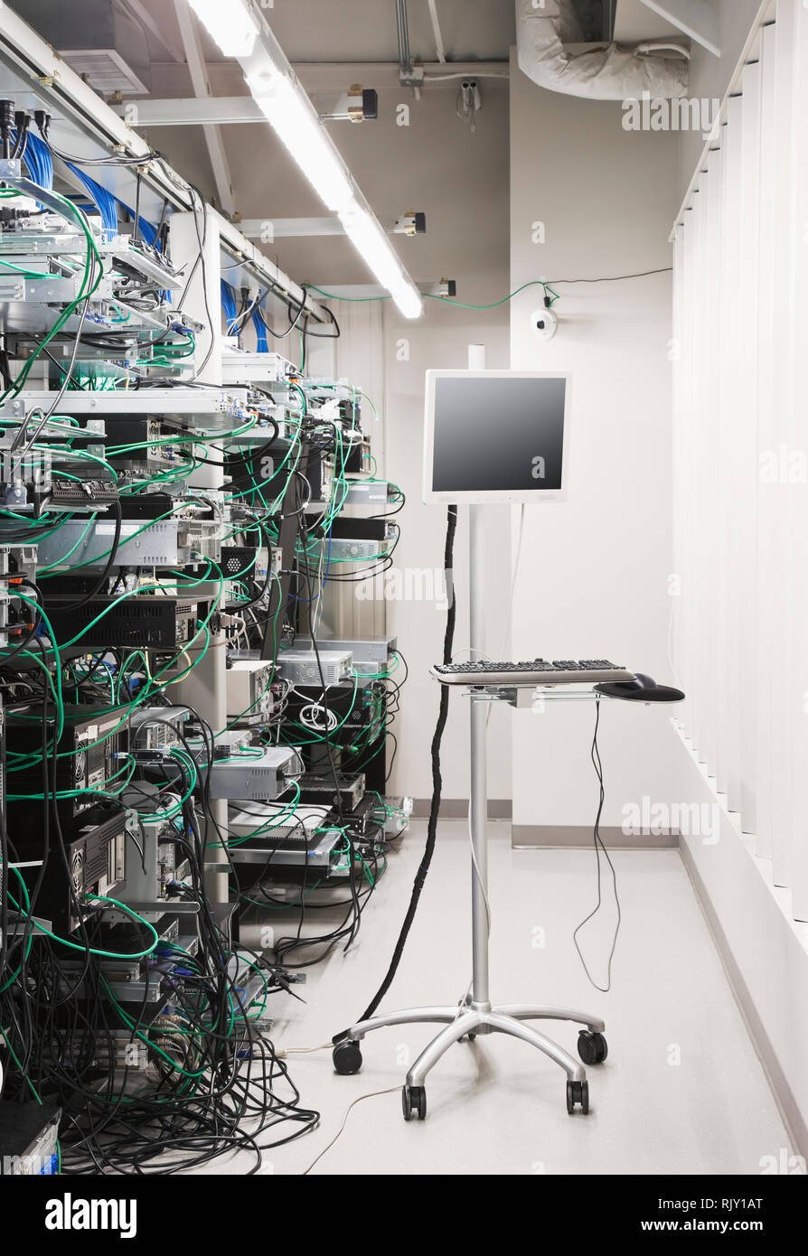 Tangled computer server cords in server room Stock Photo - Alamy