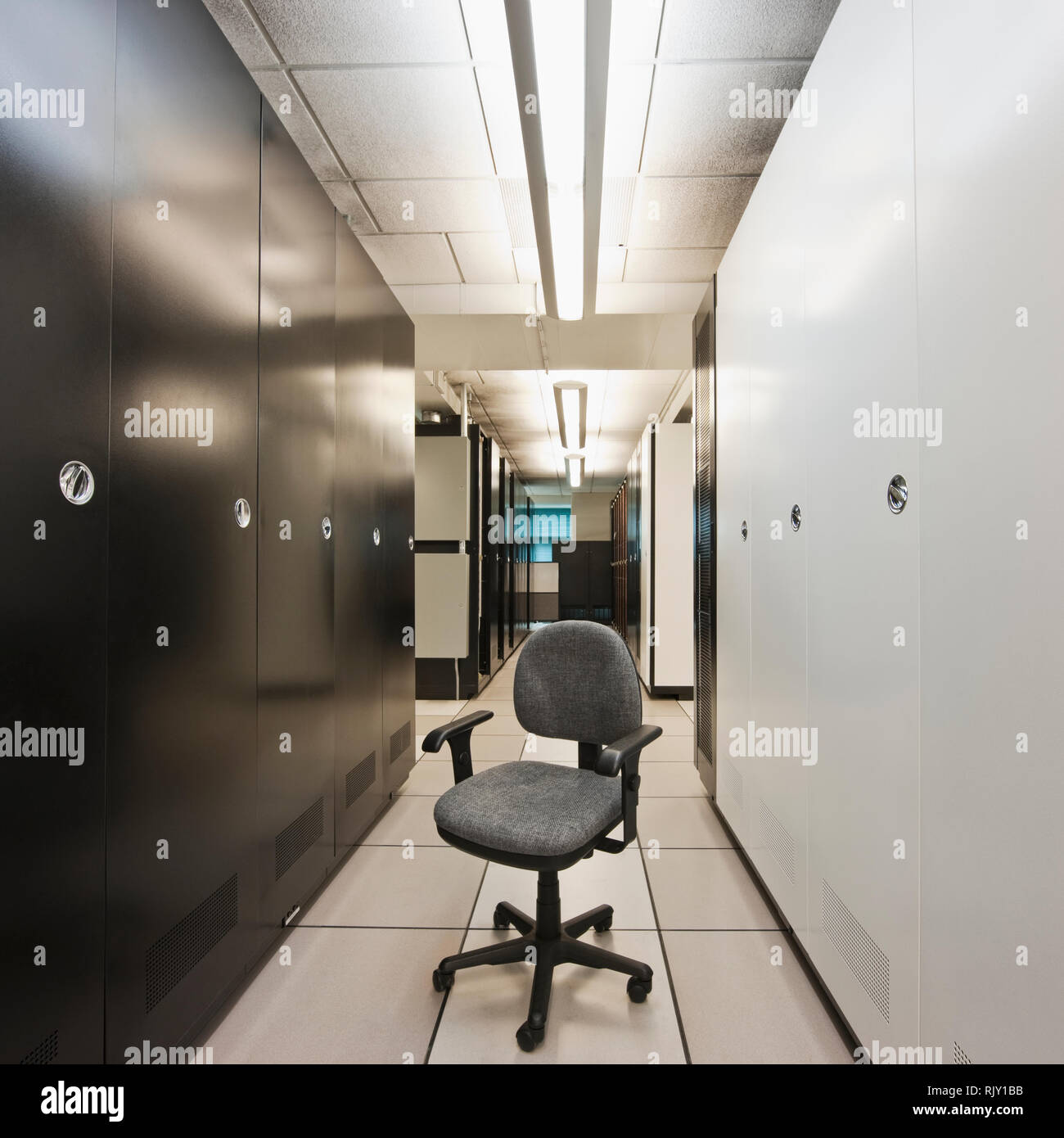 Desk chair in server room Stock Photo - Alamy