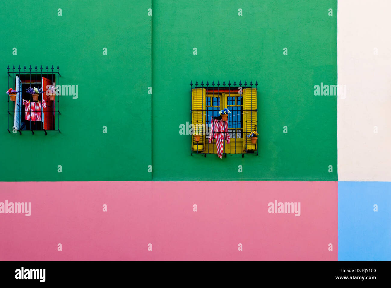 Windows in Colorful Building Exterior Stock Photo - Alamy