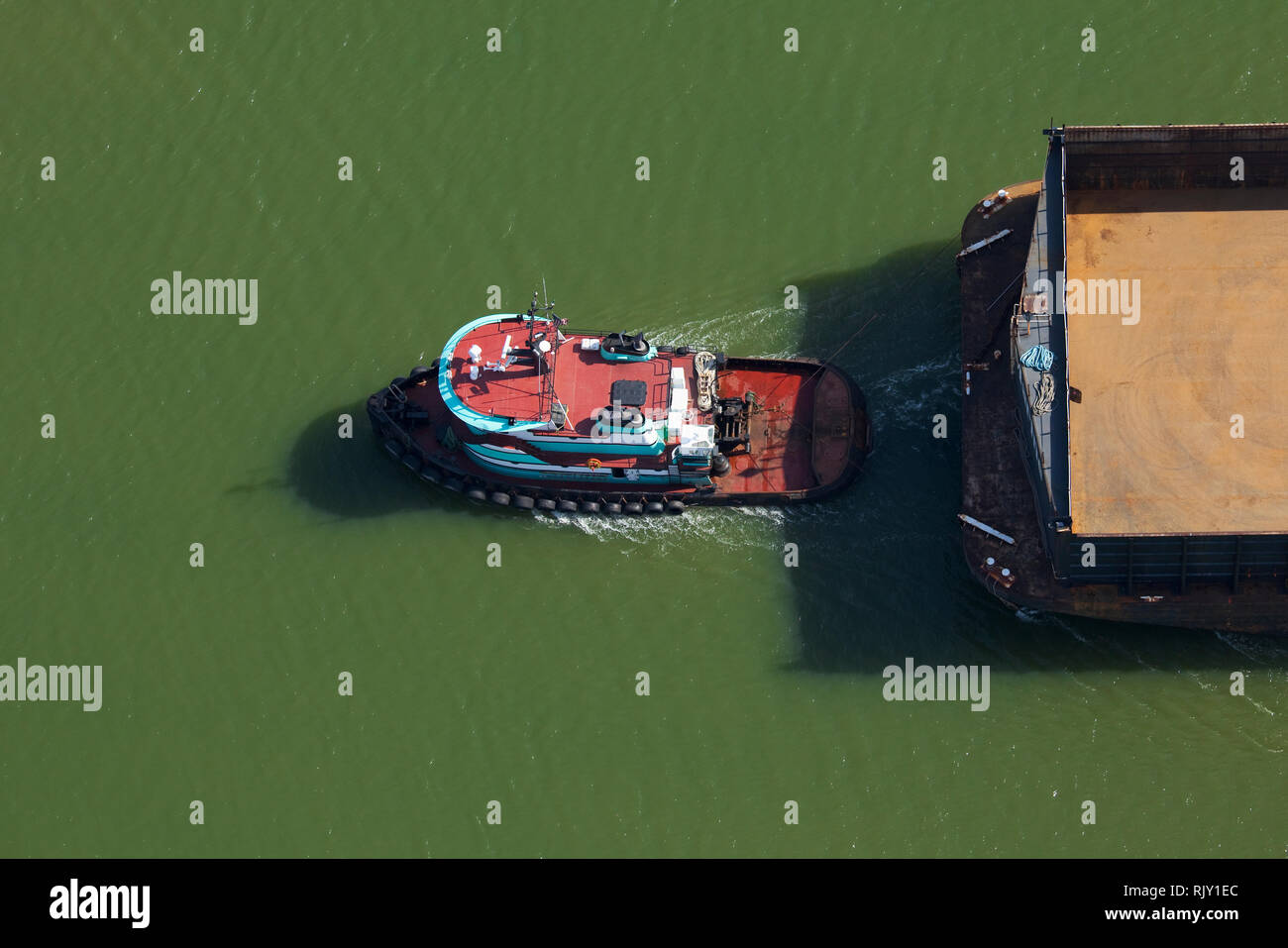 Tugboat pulling shipping container barge hi-res stock photography and ...