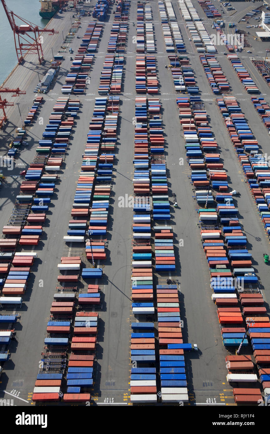 Cargo containers in a row at commercial dock Stock Photo - Alamy