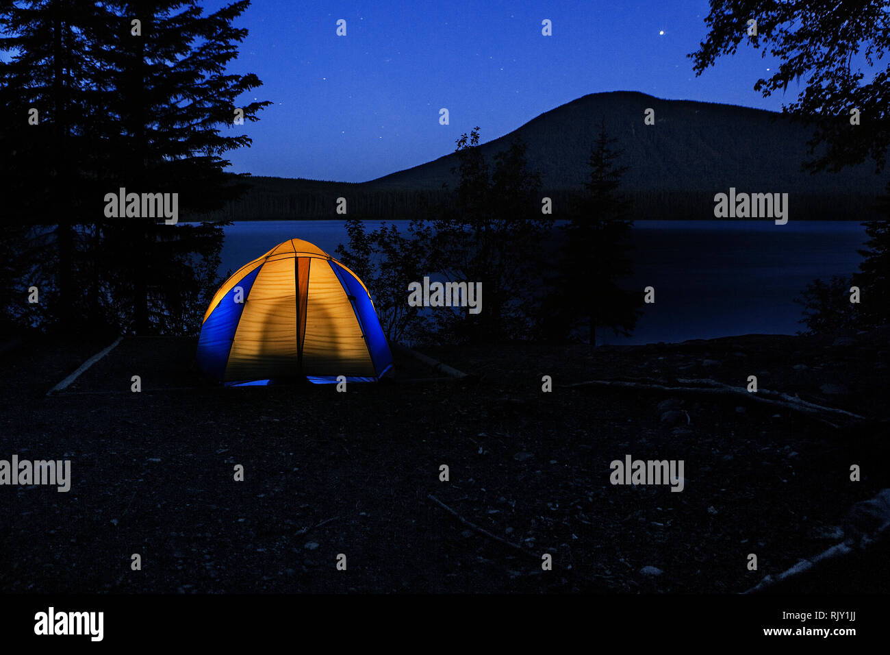 Campsite at Night Stock Photo - Alamy