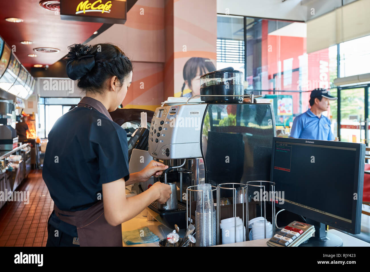 PATTAYA, THAILAND - FEBRUARY 25, 2016: worker at McCafe in Thailand ...