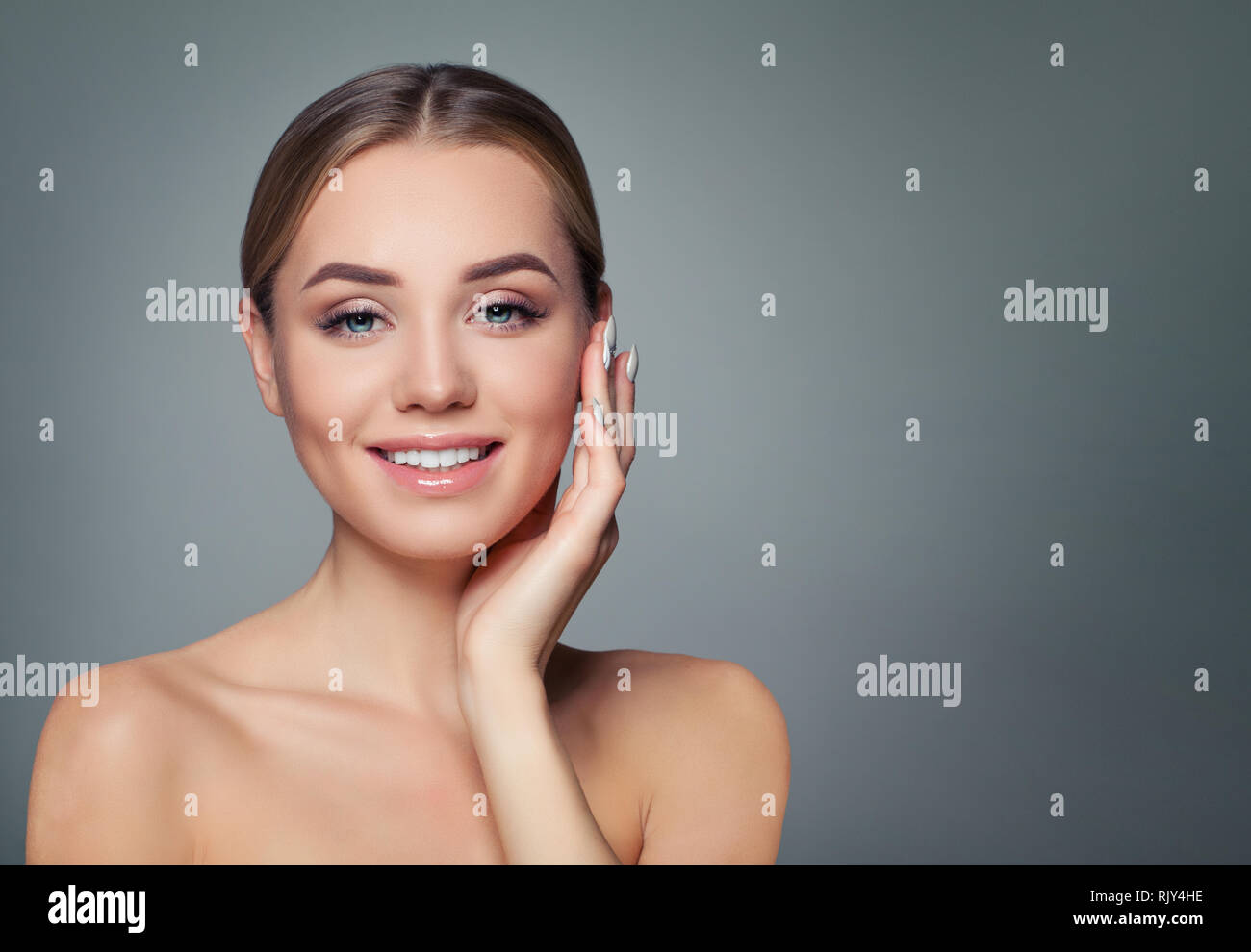 Young woman face. Healthy skin, cute smile. Perfect girl smiling ...