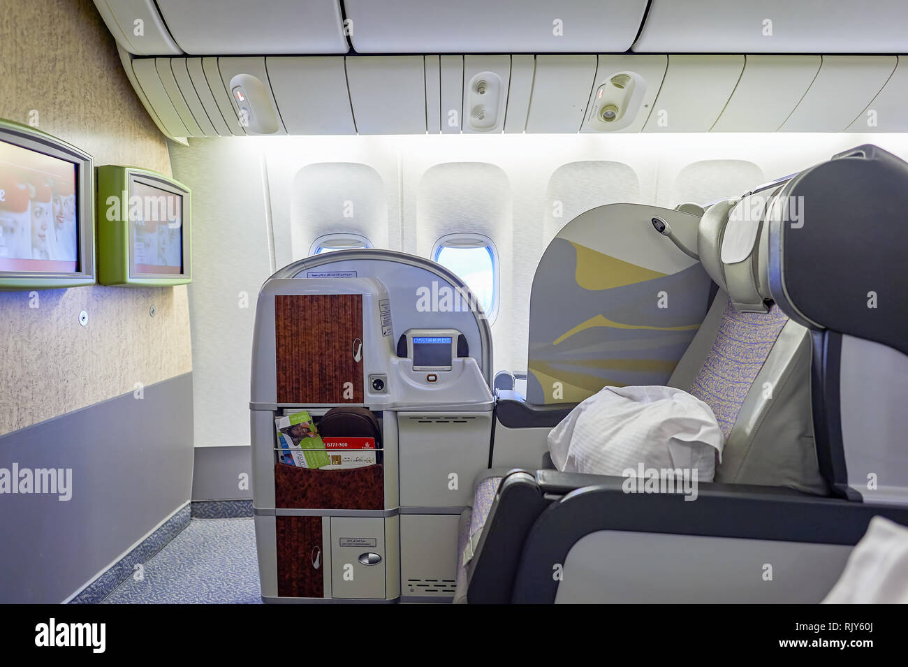 DUBAI, UAE - MARCH 30, 2015: inside of Emirates Boeing-777. Emirates is ...