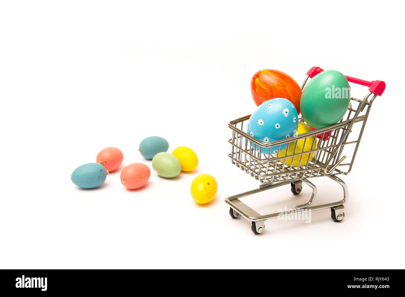 Easter shopping. Handmade colored eggs in cart. Business and selling in ...