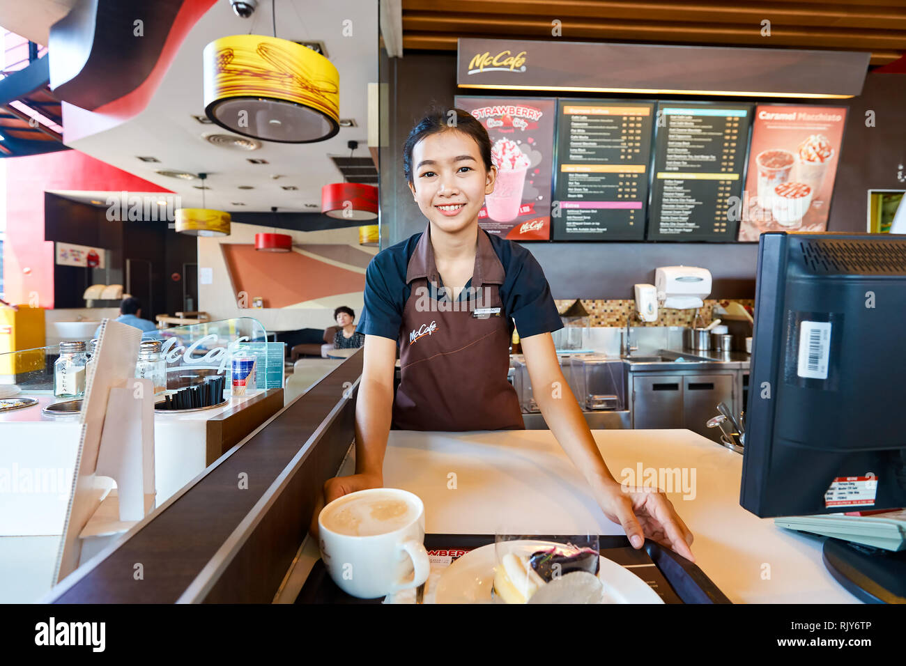 PATTAYA, THAILAND - FEBRUARY 25, 2016: worker at McCafe in Thailand ...