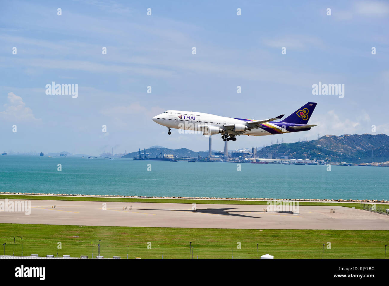HONG KONG - JUNE 04, 2015: THAI aircraft landing at Hong Kong airport ...