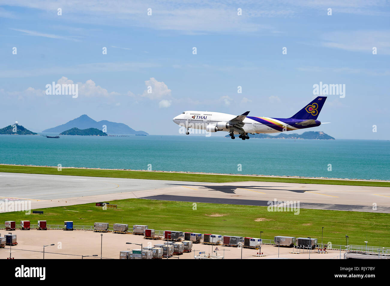 HONG KONG - JUNE 04, 2015: THAI aircraft landing at Hong Kong airport ...