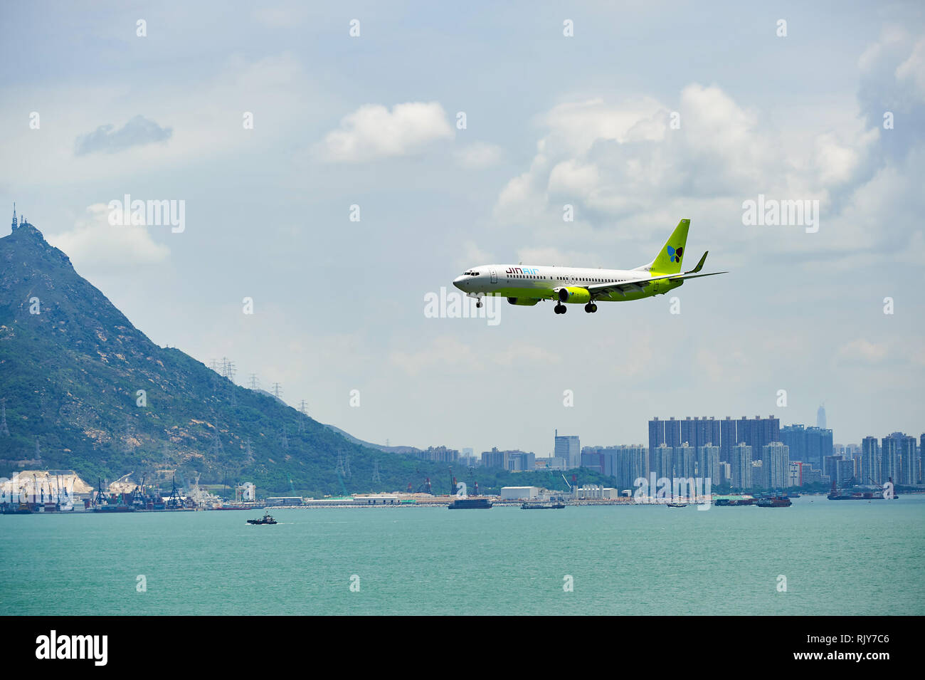 HONG KONG - JUNE 04, 2015: Jin Air aircraft landing at Hong Kong ...