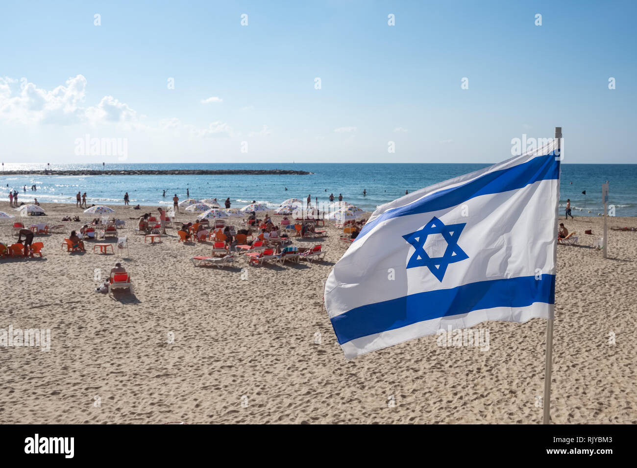 Israel state flag on a beach in Tel Aviv with blurred background Stock ...