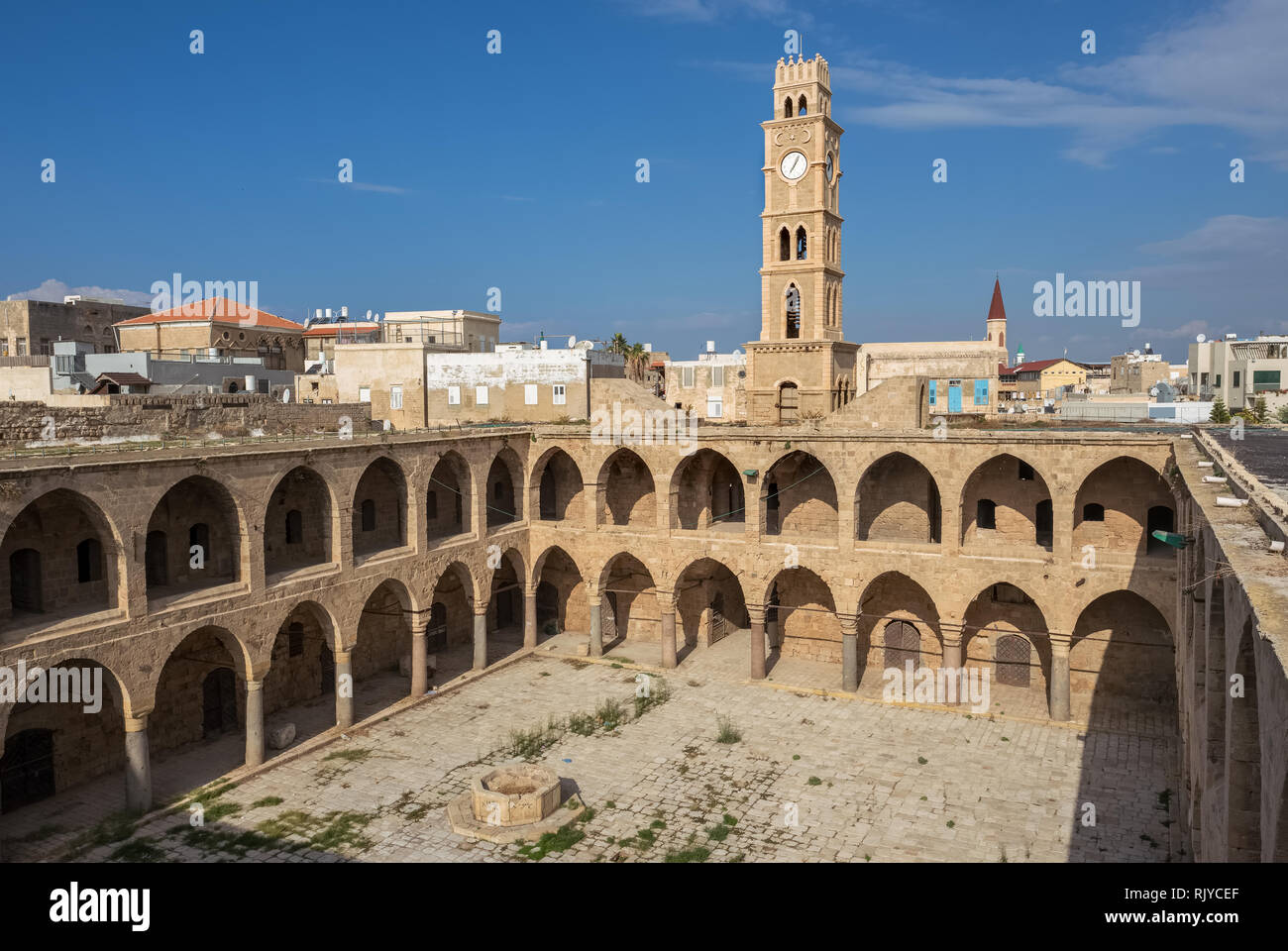Khan al-Umdan caravanserai with ottoman clock tower in Acre, Israel ...