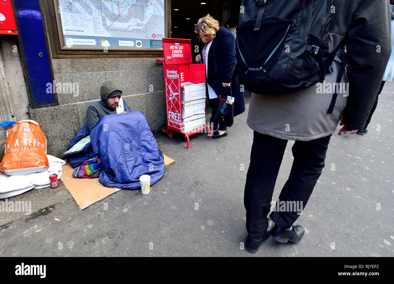 London, England, UK. Homeless man outside Holborn underground station ...