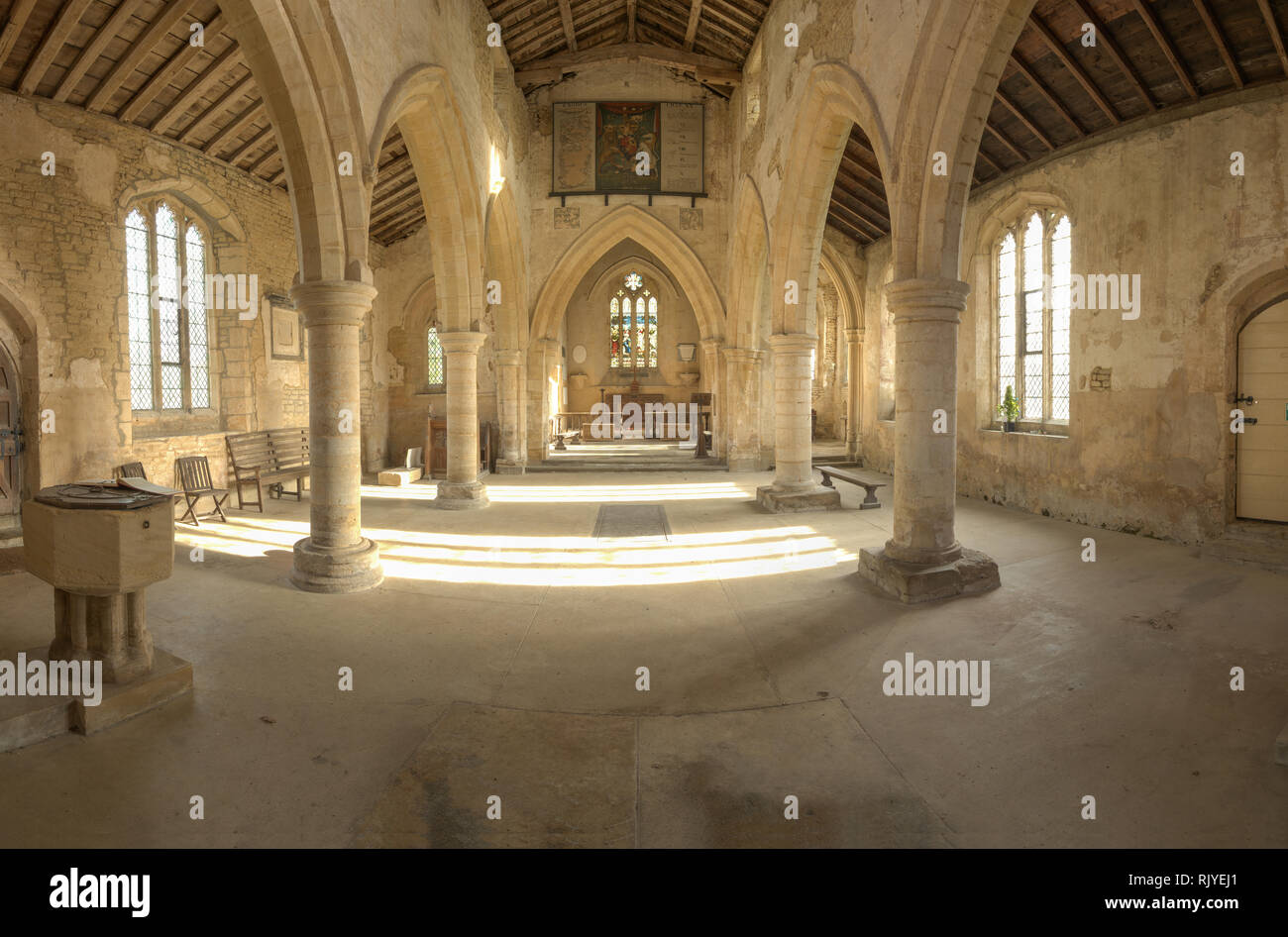 Sunlight streaming through the windows of a medieval gothic stone ...