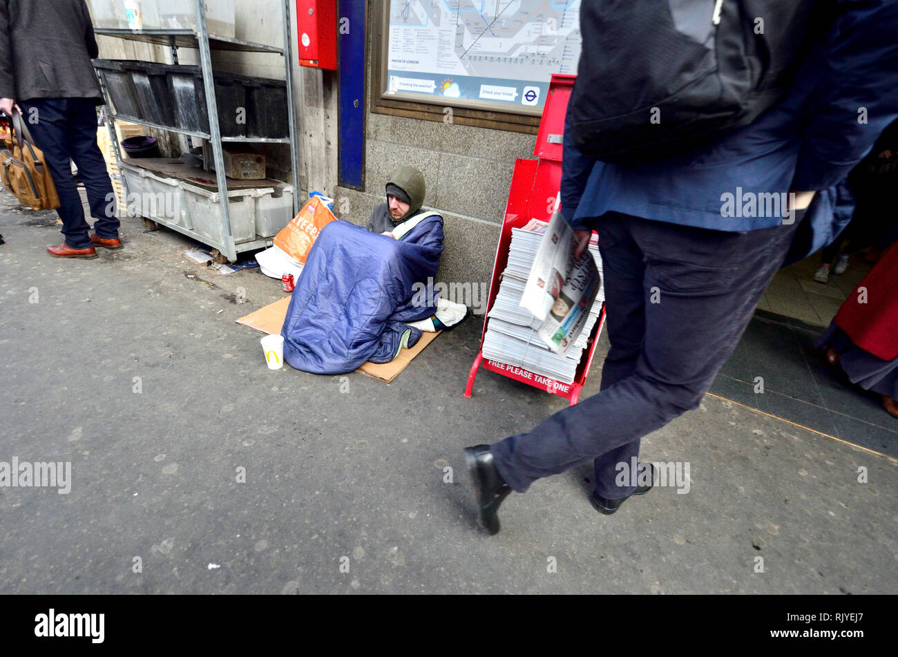 London, England, UK. Homeless man outside Holborn underground station ...