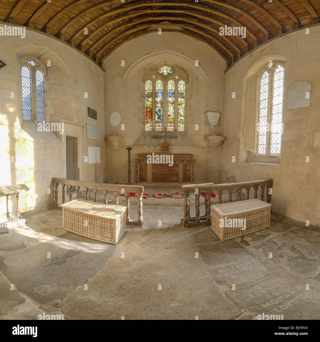 Sunlight streaming through the windows of a medieval gothic stone ...