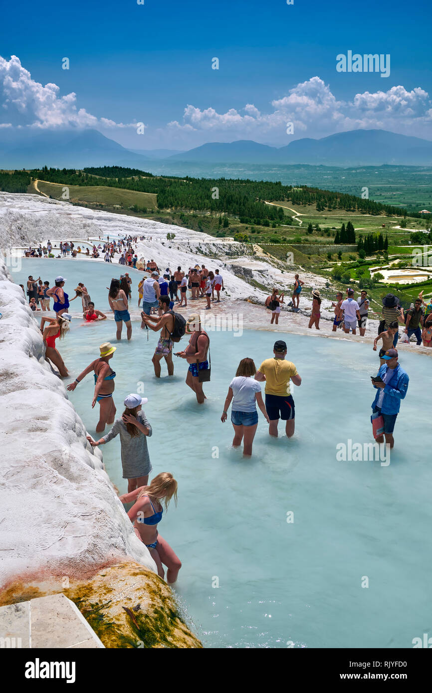 Tourists bathing in the travatine pools oand thermal waters of ...