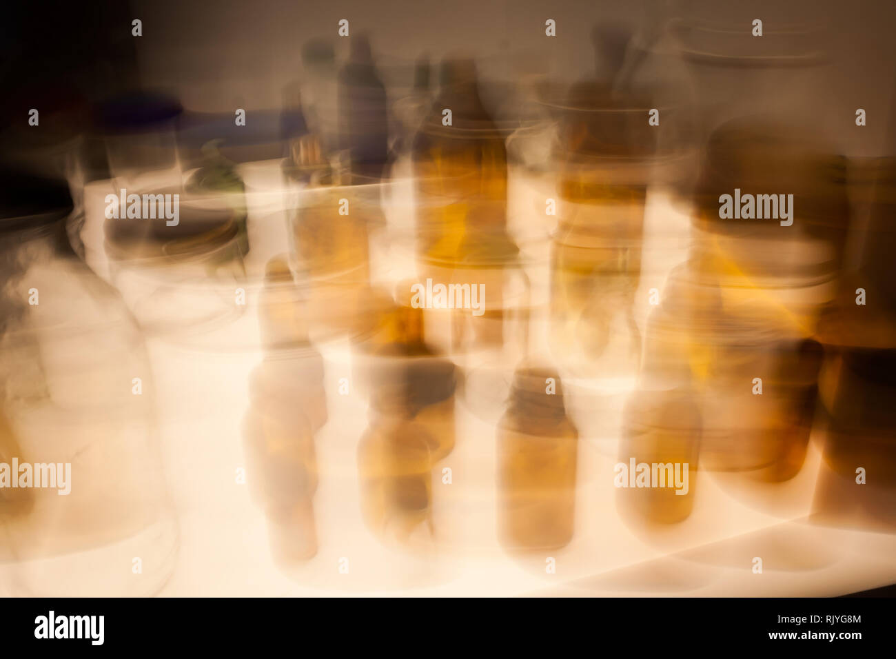 Abstract blurred colorful light effect on a glass bottles. Long ...