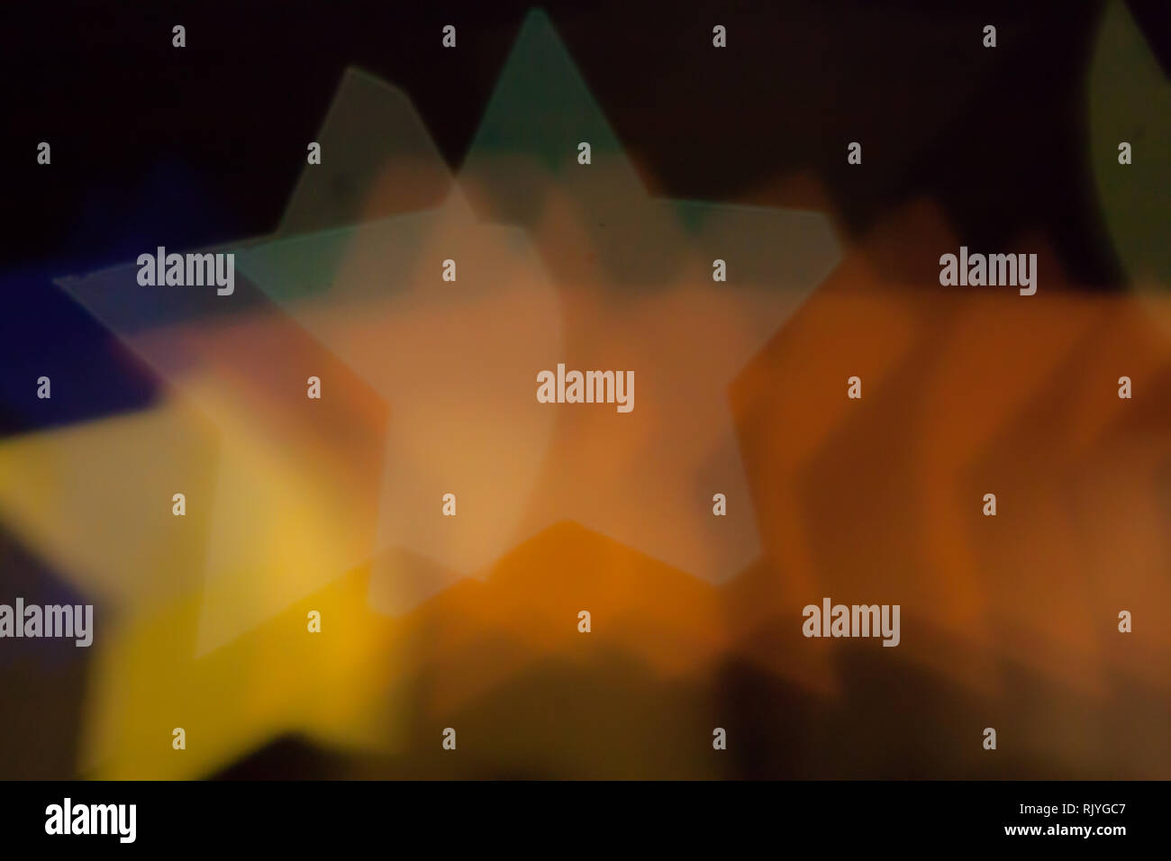 Blurred photo of defocused bokeh colorful lights in the shape of star ...