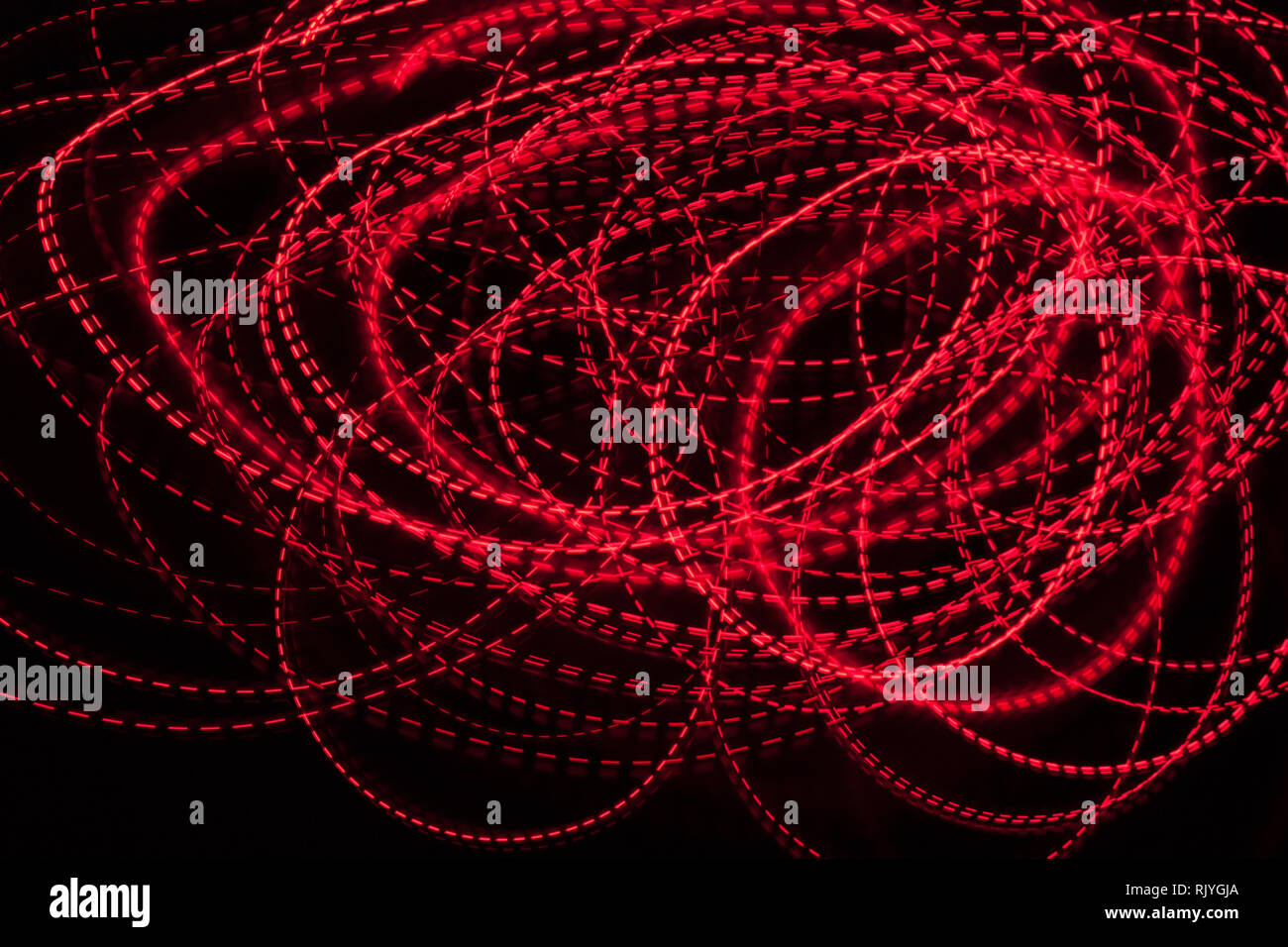 Abstract blurred red light effect on a black background. Long exposure ...