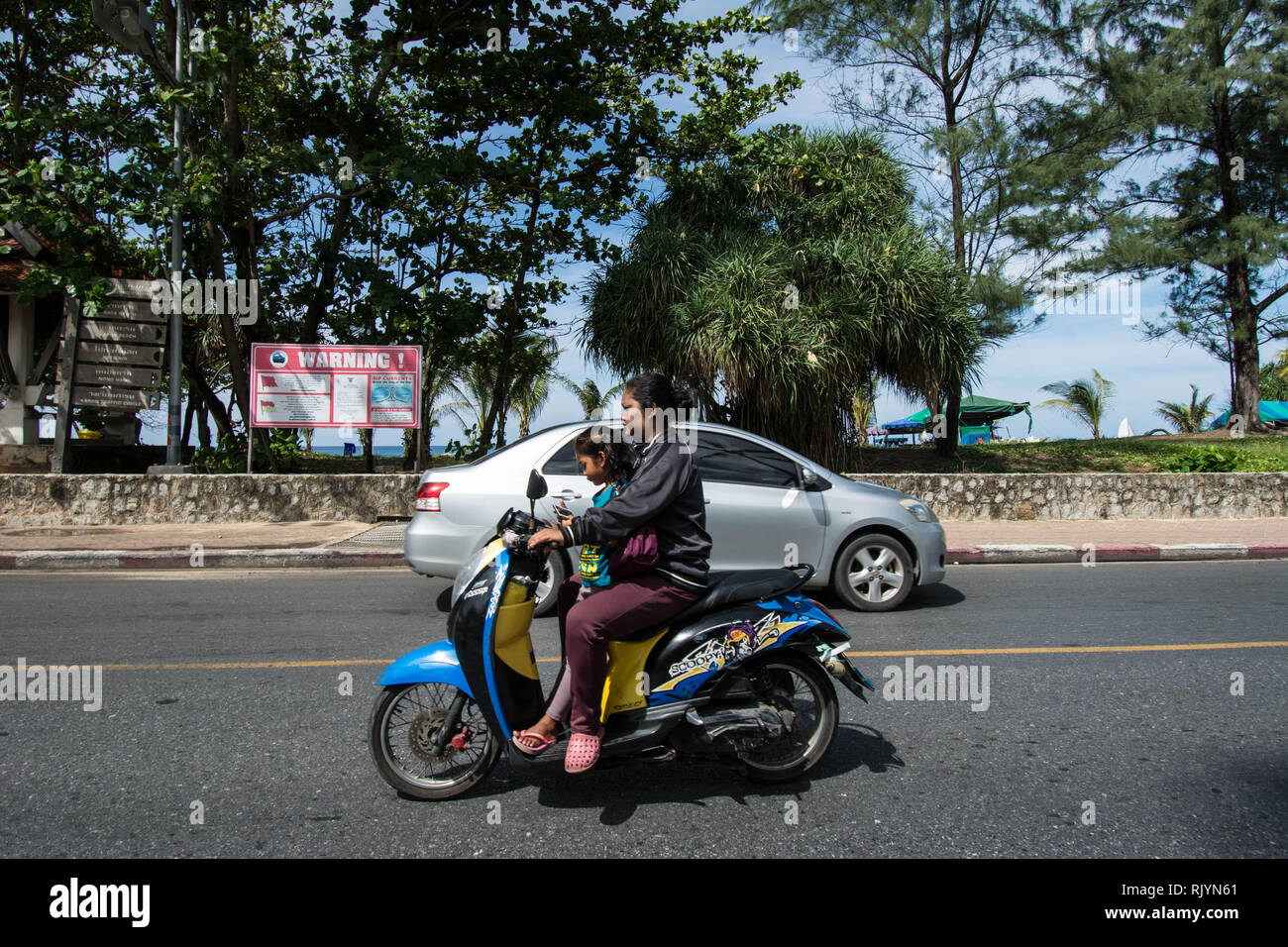 Mother and child on motorbike Phuket Thailand girl baby bike motor ...