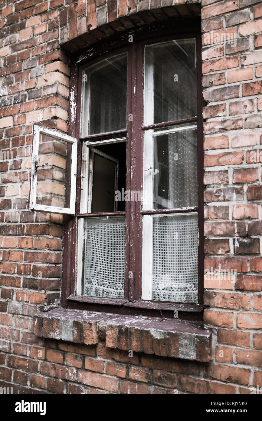 open window in rundown Eastern European brick tenement house Stock ...