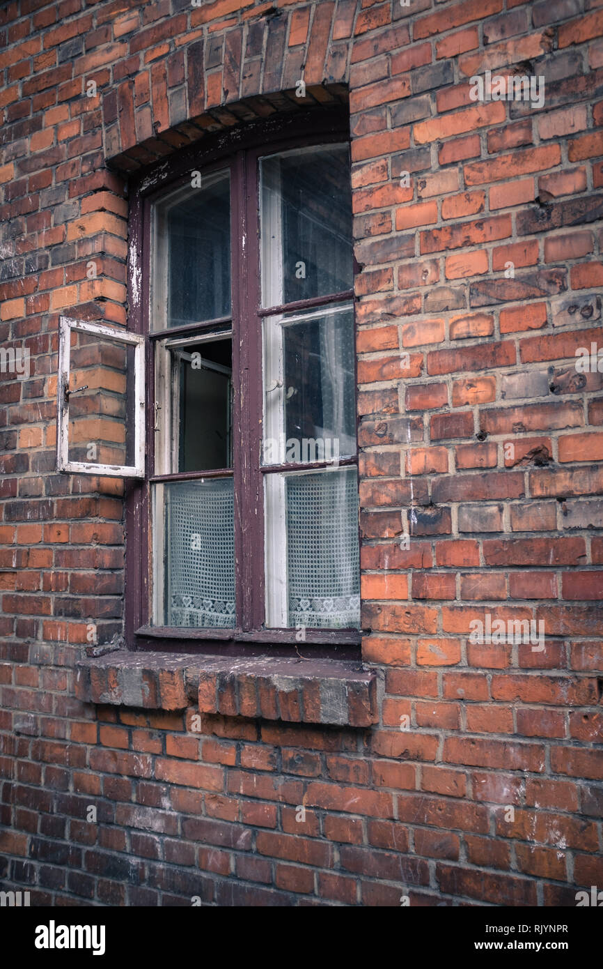 open window in rundown Eastern European brick tenement house Stock ...