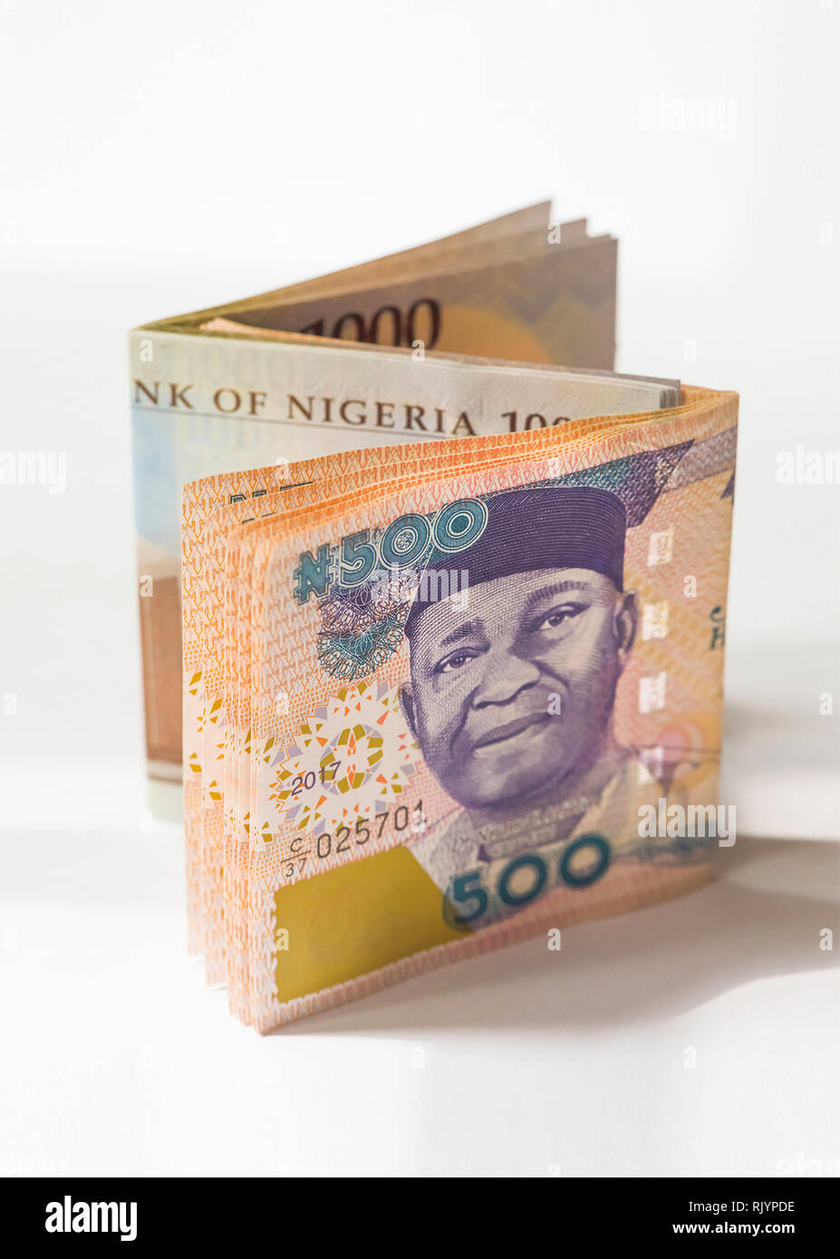 Nigerian Money - A folded wad of 1000 and 500 Naira notes mixed ...