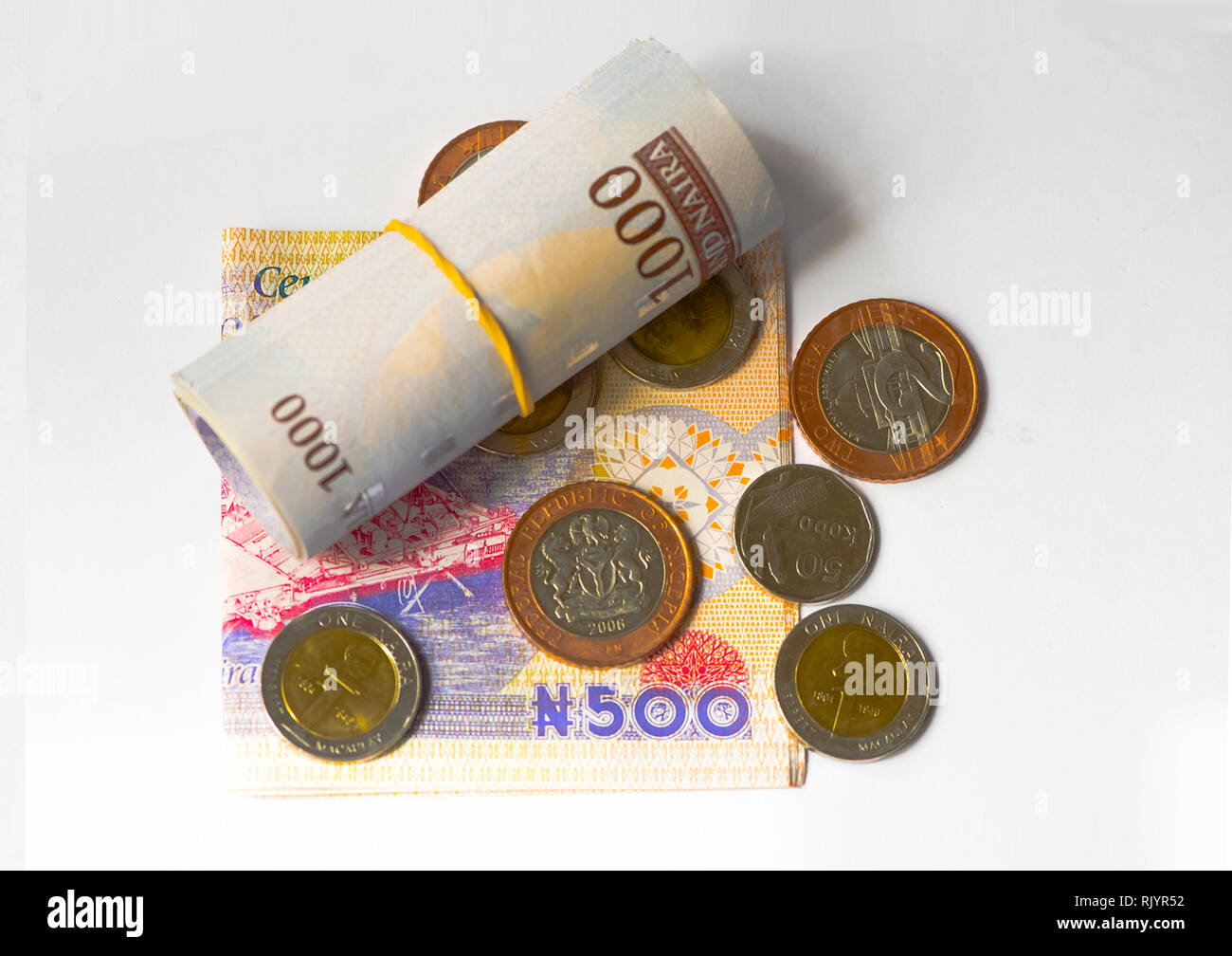 Nigerian Money - A folded wad of 1000 and 500 Naira notes with some ...