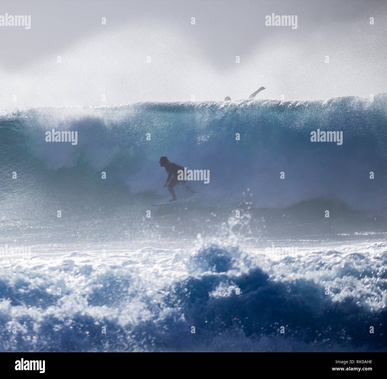 Surfer riding huge wave Stock Photo - Alamy