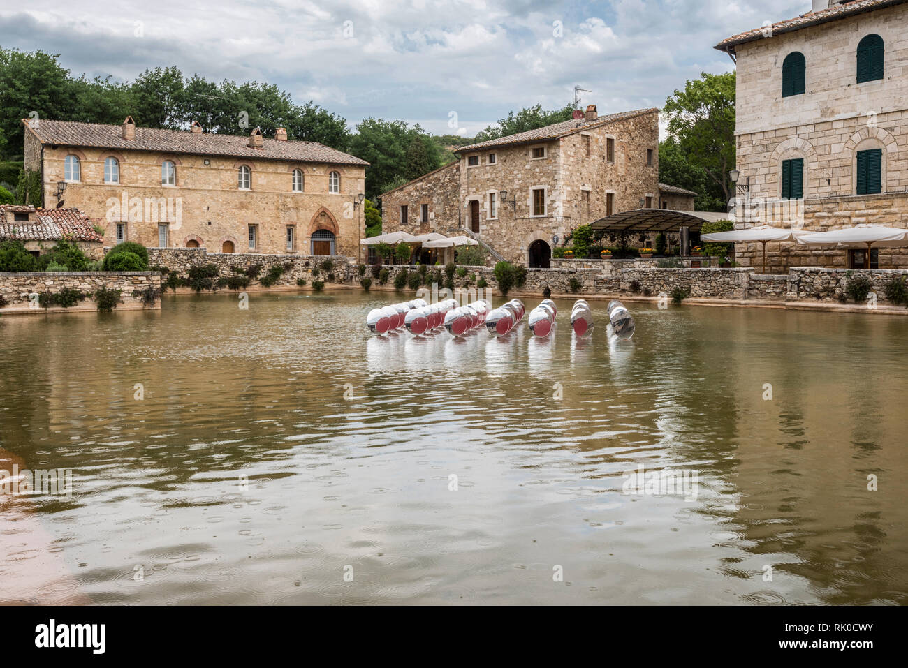 View of the village of Bagno Vignoni from the pool of thermal waters ...