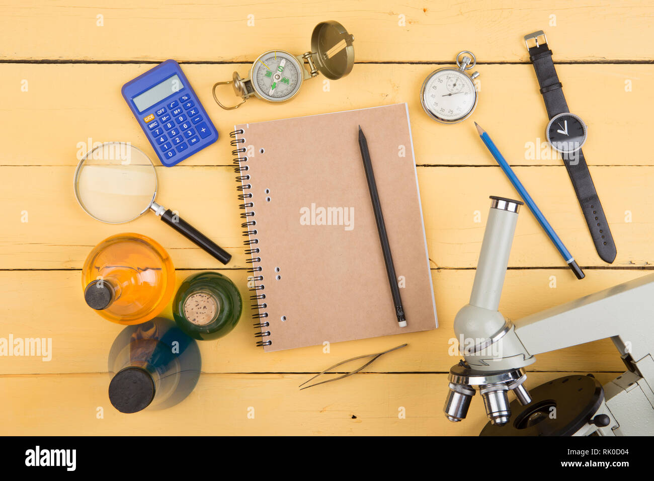 Education concept - notepad, microscope on the wooden desk Stock Photo ...