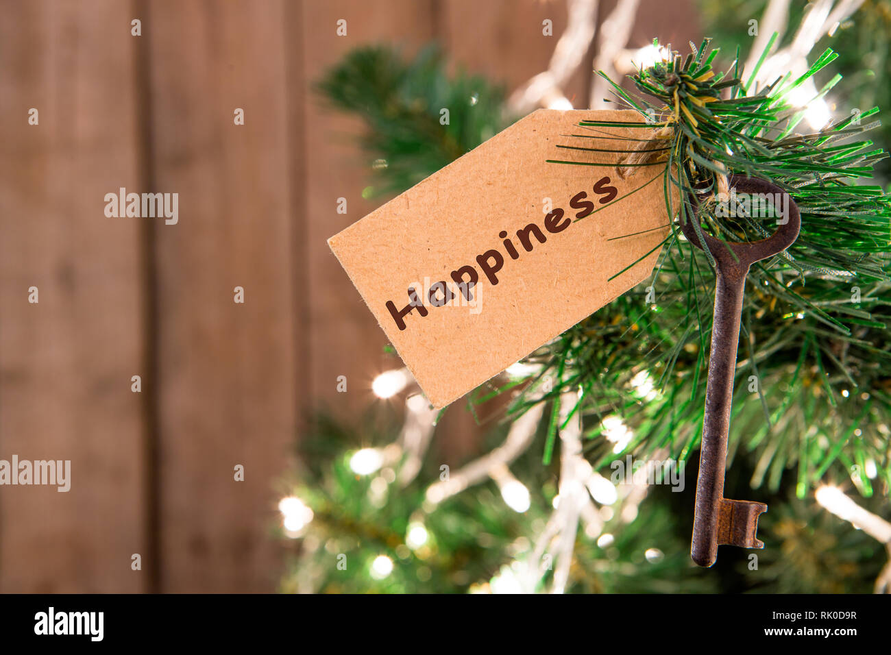 Christmas wishes concept - key with inscription Happiness on tag Stock ...