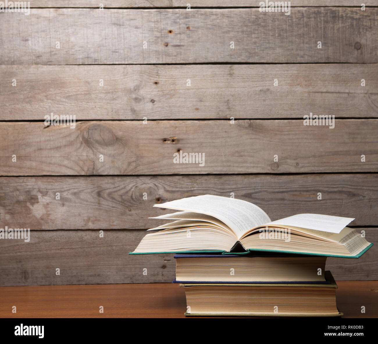 Open book on the wooden background Stock Photo - Alamy