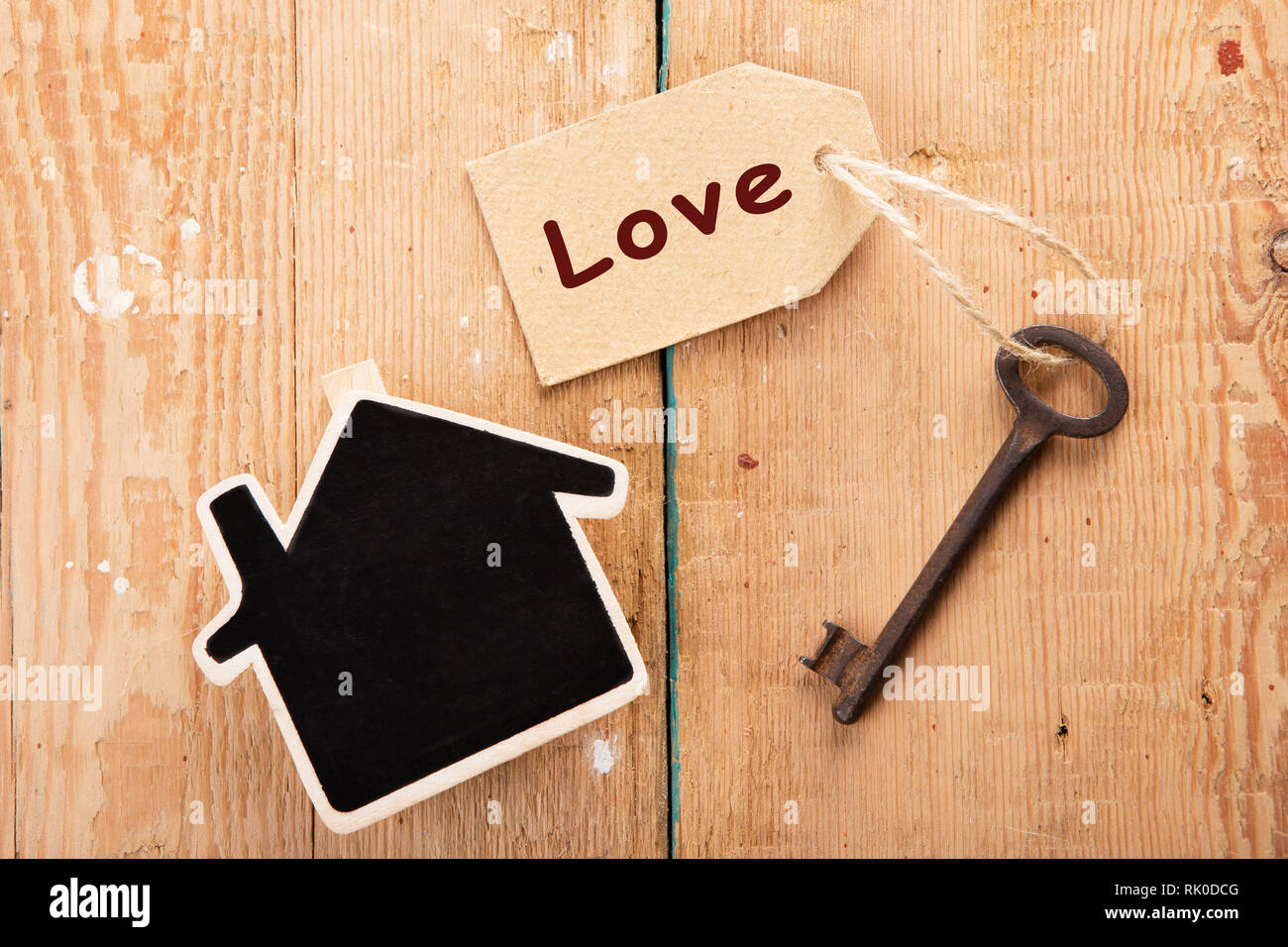 home security concept - little house and old key Stock Photo - Alamy