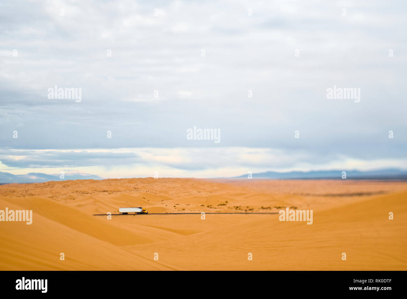 Truck Driving Through Desert Stock Photo - Alamy