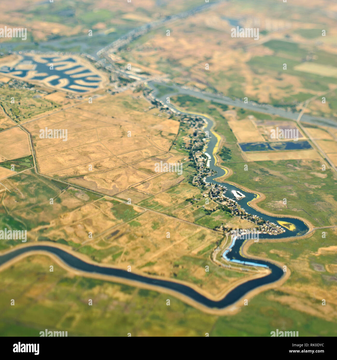 River Through Farmland Stock Photo - Alamy