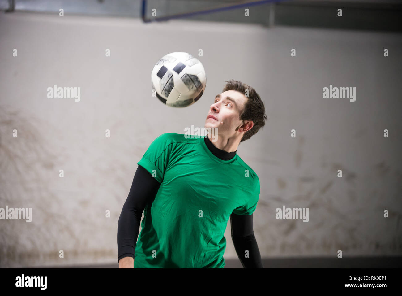 Soccer player training his skills with a ball. Mid shot Stock Photo - Alamy