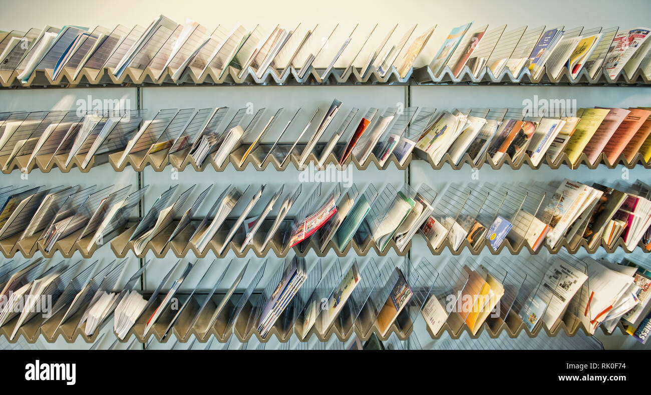 Racks of Brochures on Shelves Stock Photo - Alamy