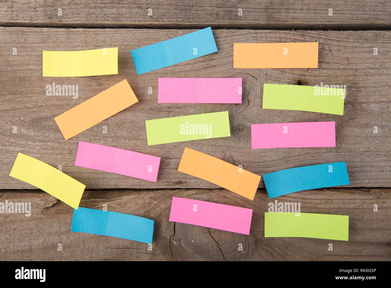 Colorful sticky notes on the wooden board Stock Photo - Alamy