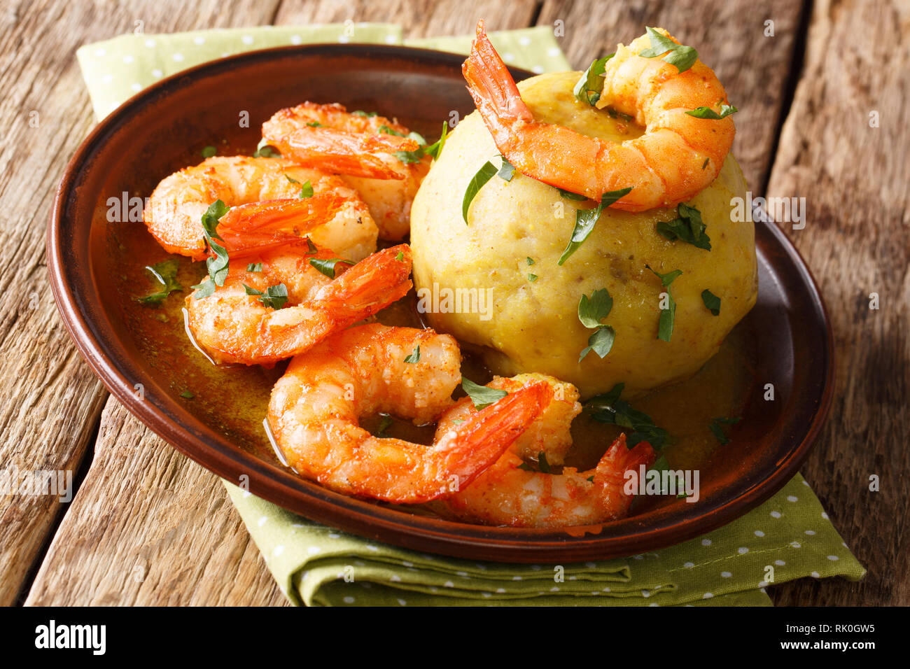 Mofongo mashed plantains, garlic and chicharron served with shrimps and ...