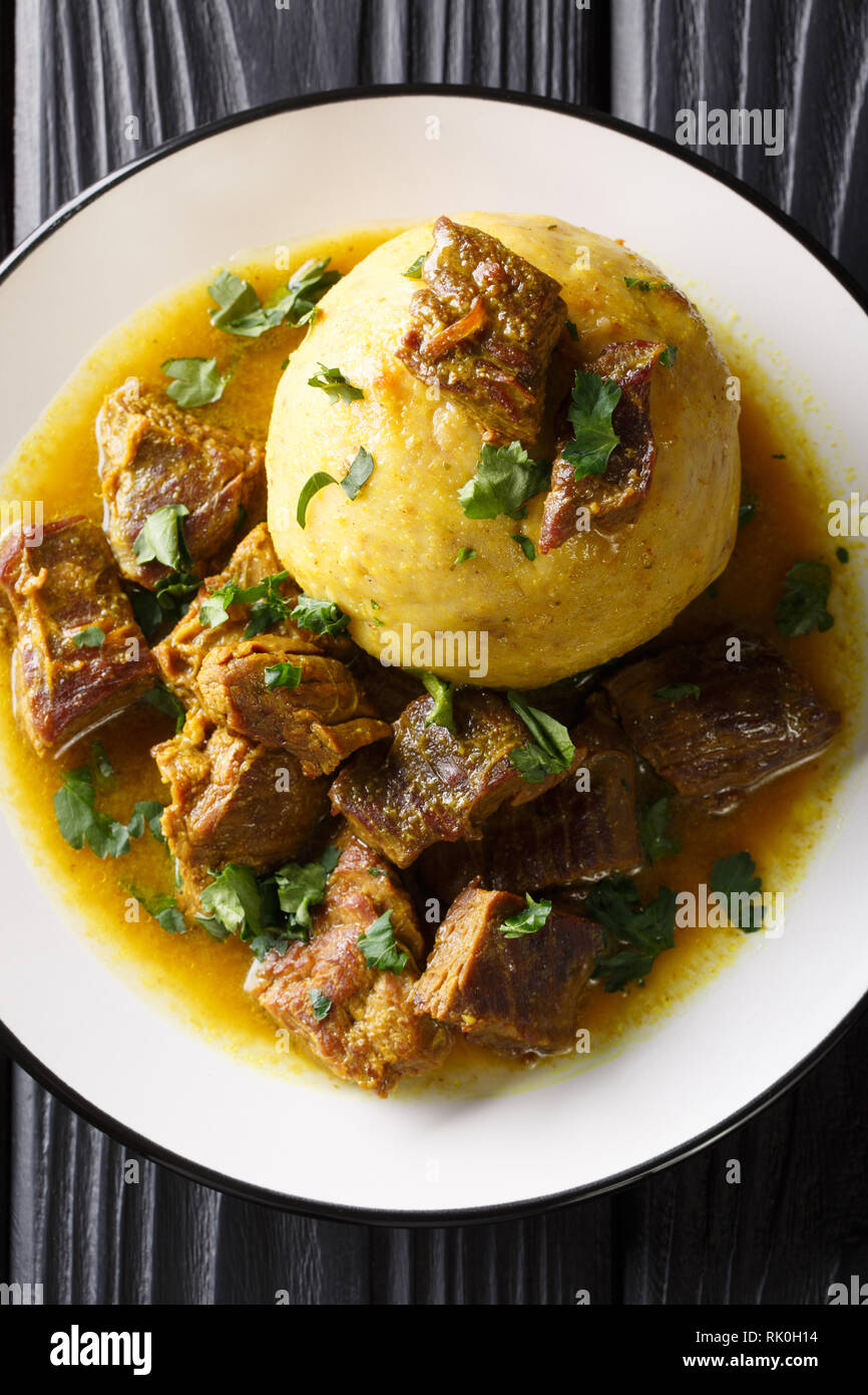 Mofongo made of plantain and chicharron served with meat and broth ...