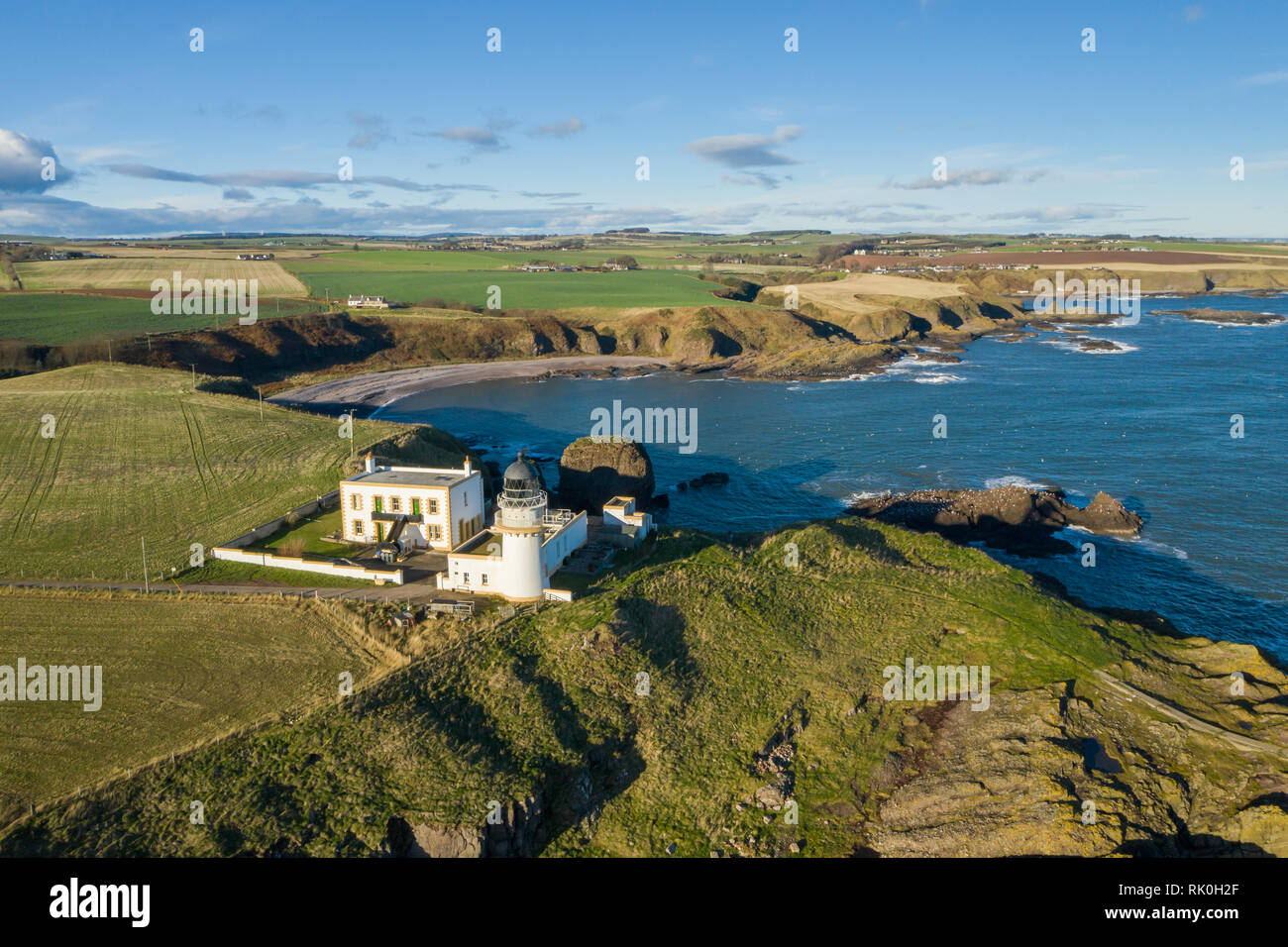 An aerial view of Tod Head lighthouse near Catterline on a sunny day ...