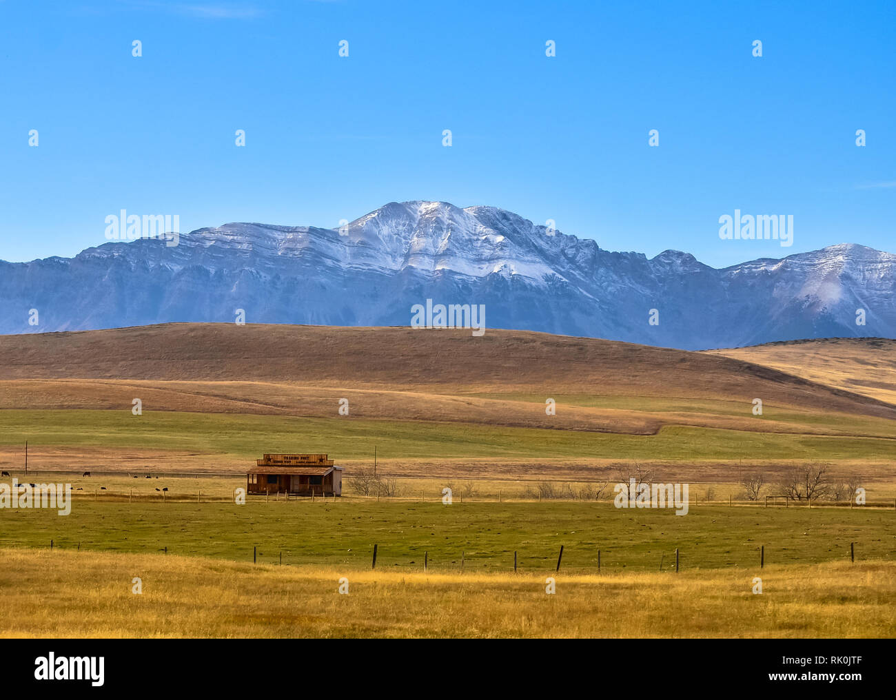 An old west trading post building in Alberta, Canada near mountains ...
