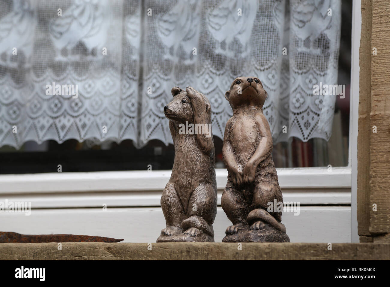 Decorative figurines of little animals on the windowsill Stock Photo ...