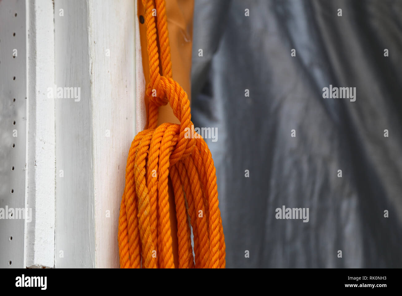 rope hanging on the wall Stock Photo - Alamy