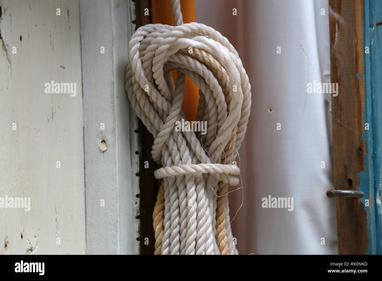 rope hanging on the wall Stock Photo - Alamy