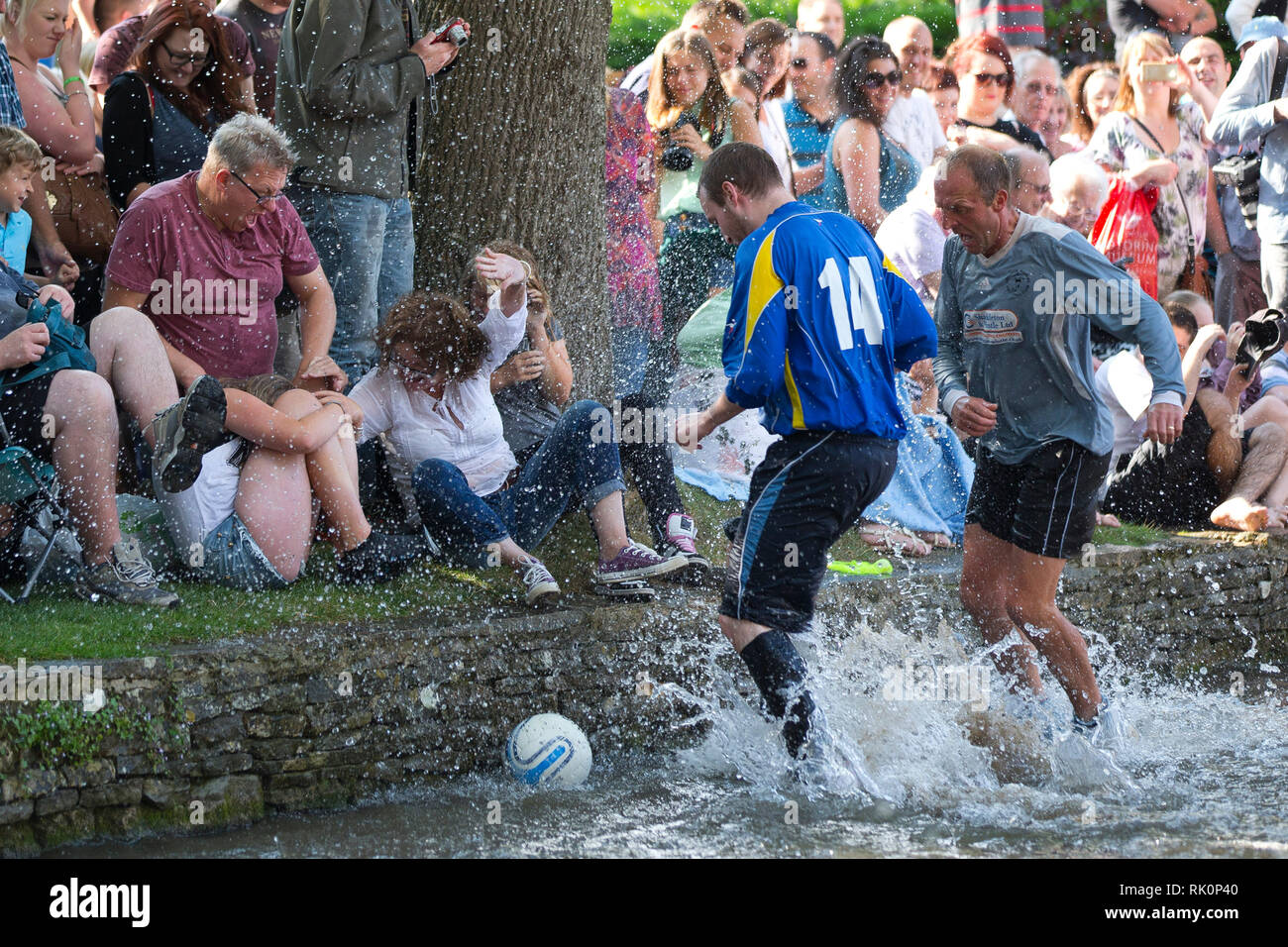 Teams play water football in the River Windrush Bourton on the water in ...