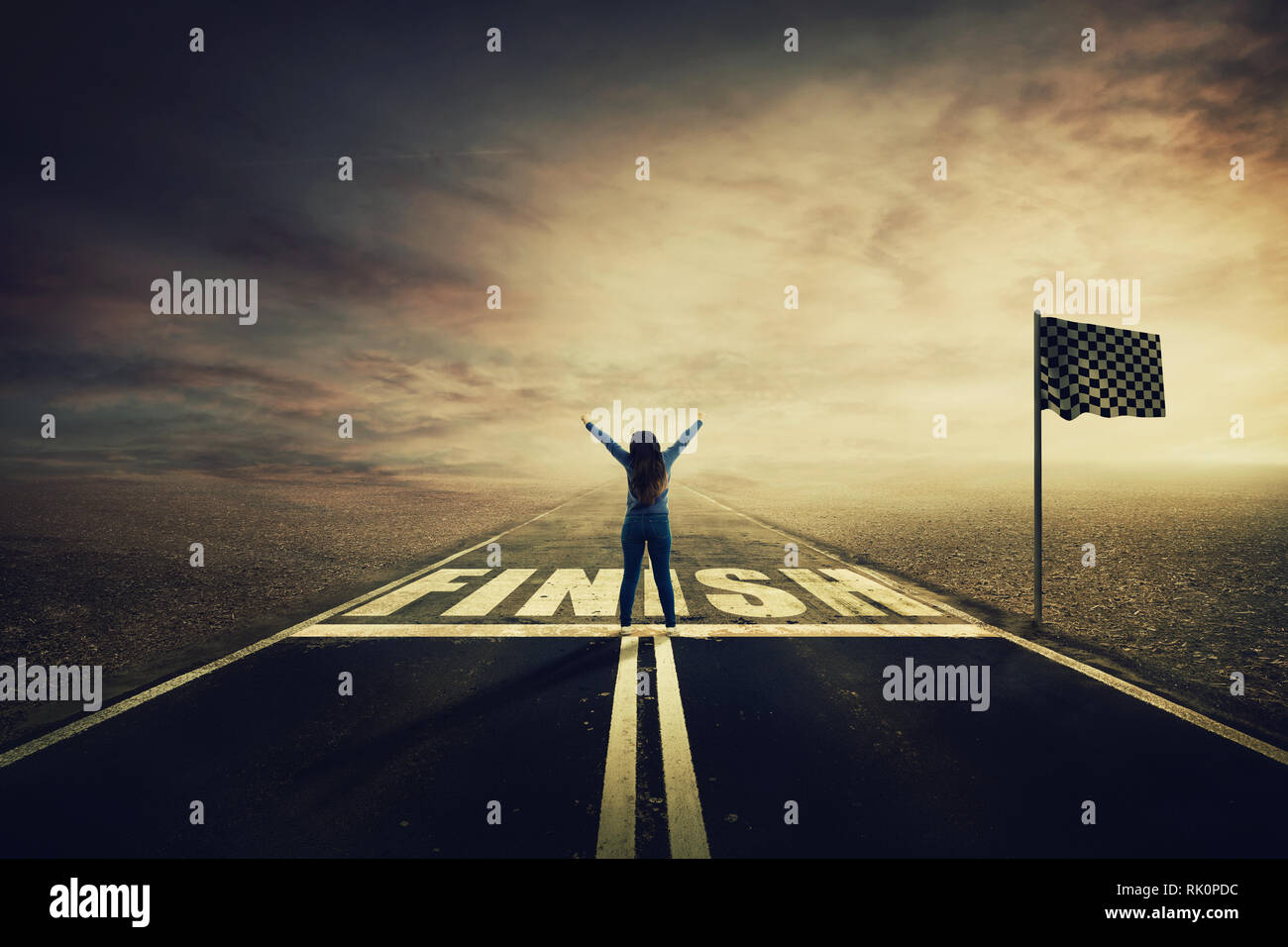 Competitive young woman on the road celebrate culmination raising hands ...