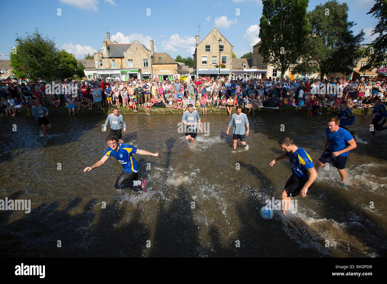 Teams play water football in the River Windrush Bourton on the water in ...